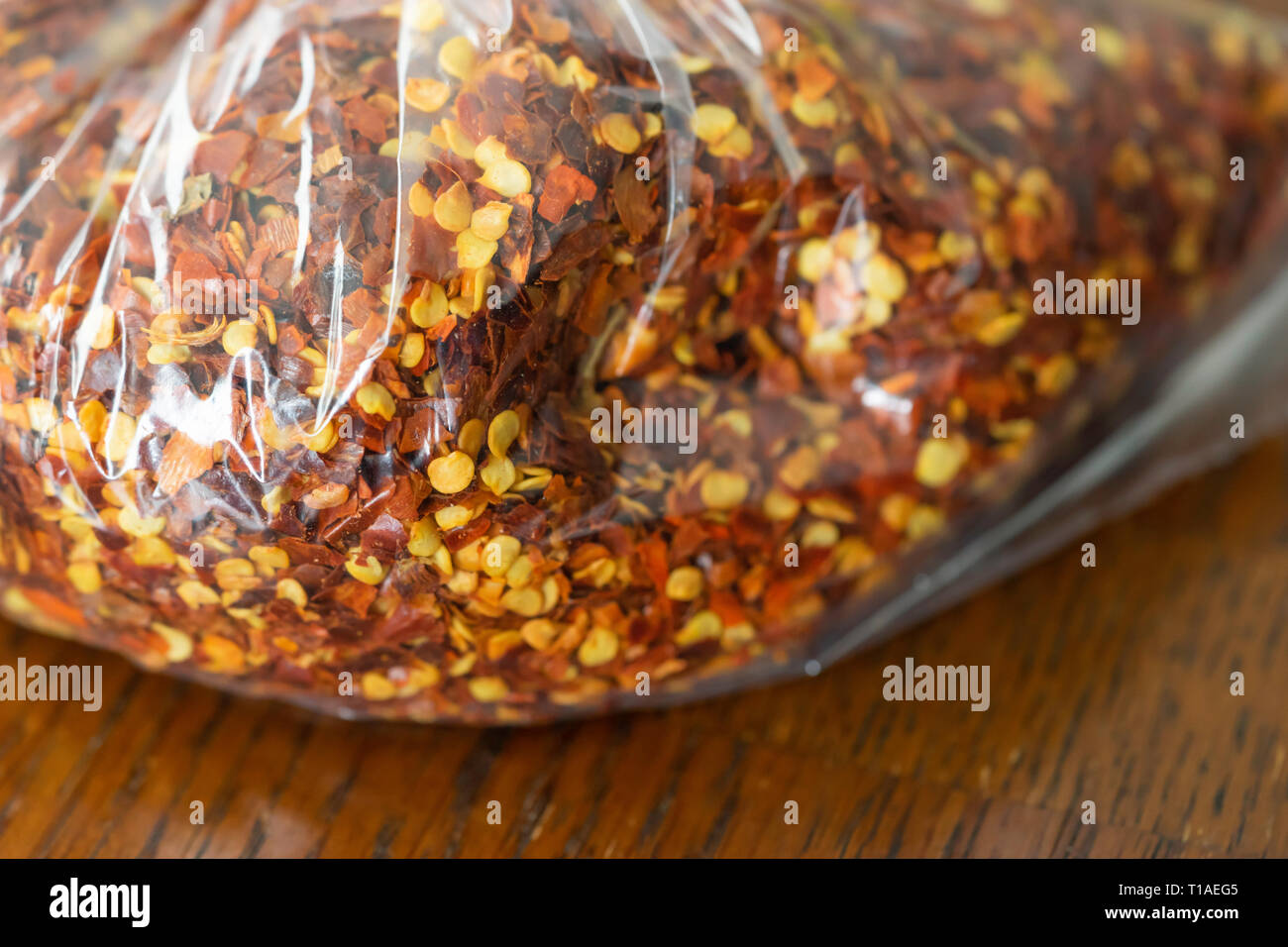 Dry ground red pepper in a bag Stock Photo - Alamy