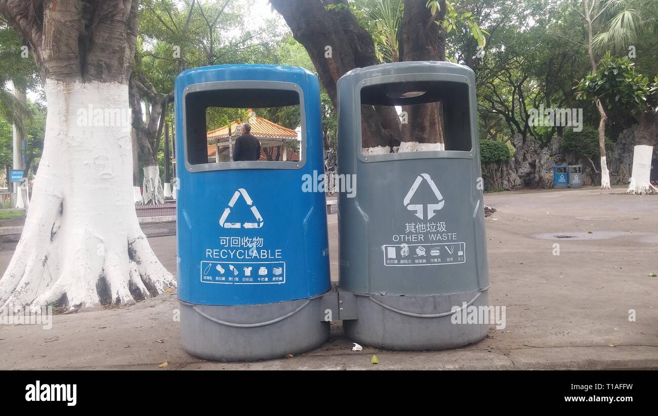 Garbage sorting bins are placed in streets or parks to facilitate ...