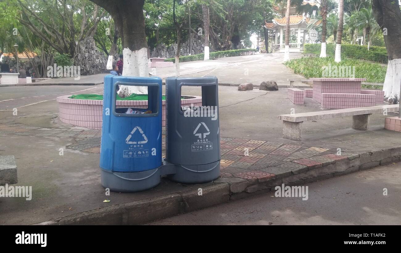 Garbage sorting bins are placed in streets or parks to facilitate ...