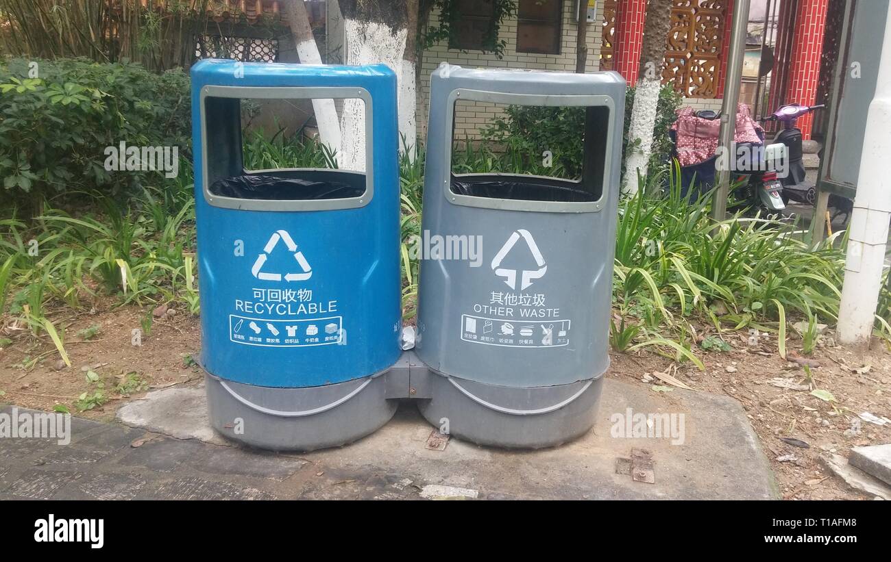Garbage sorting bins are placed in streets or parks to facilitate ...