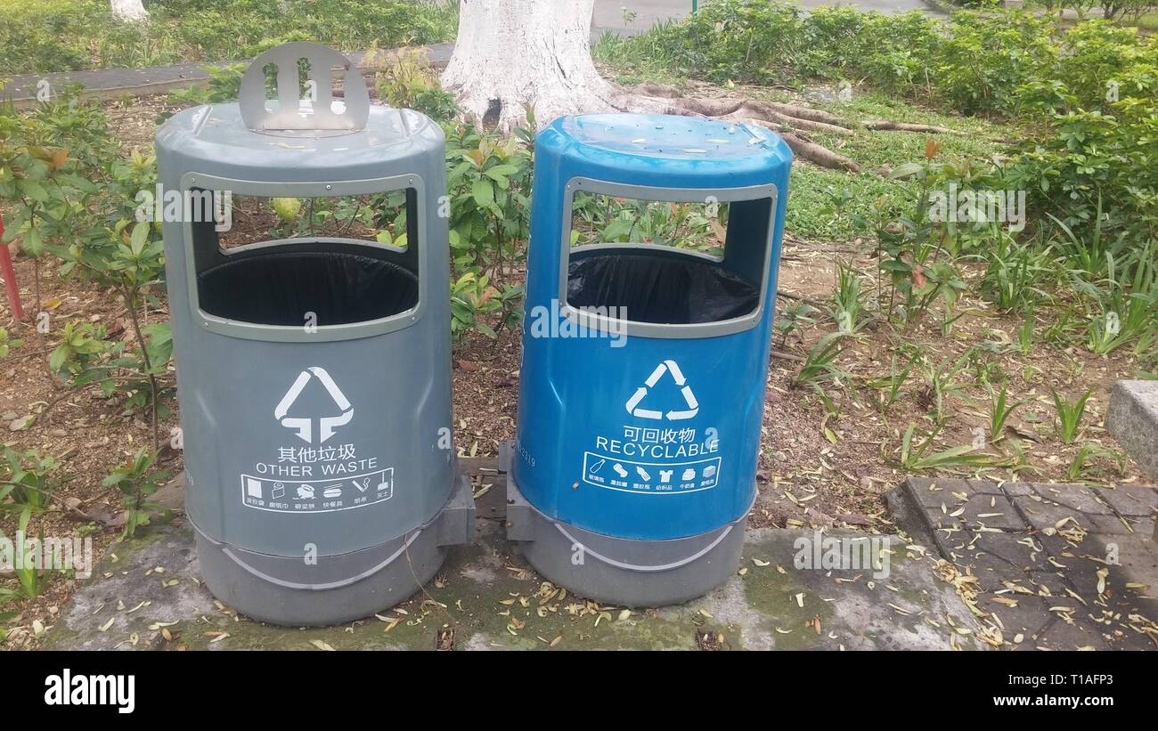 Garbage sorting bins are placed in streets or parks to facilitate ...