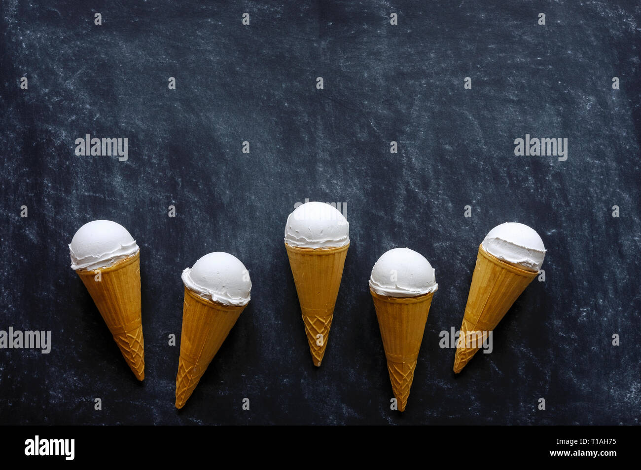 Border of five ice cream cones with delicious creamy vanilla ice-cream ...