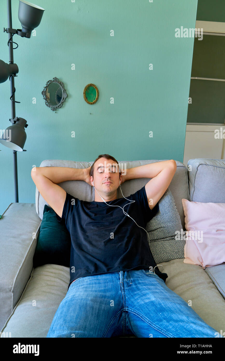 Handsome guy posing - lying down, relaxing and stretching Stock Photo ...