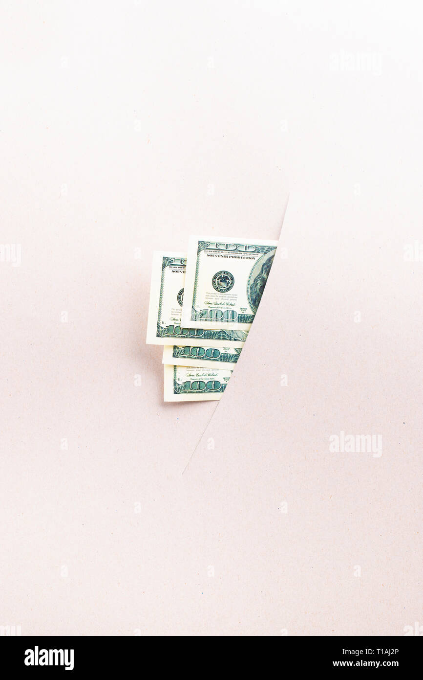 cut sheet of paper and dollar bills Stock Photo - Alamy
