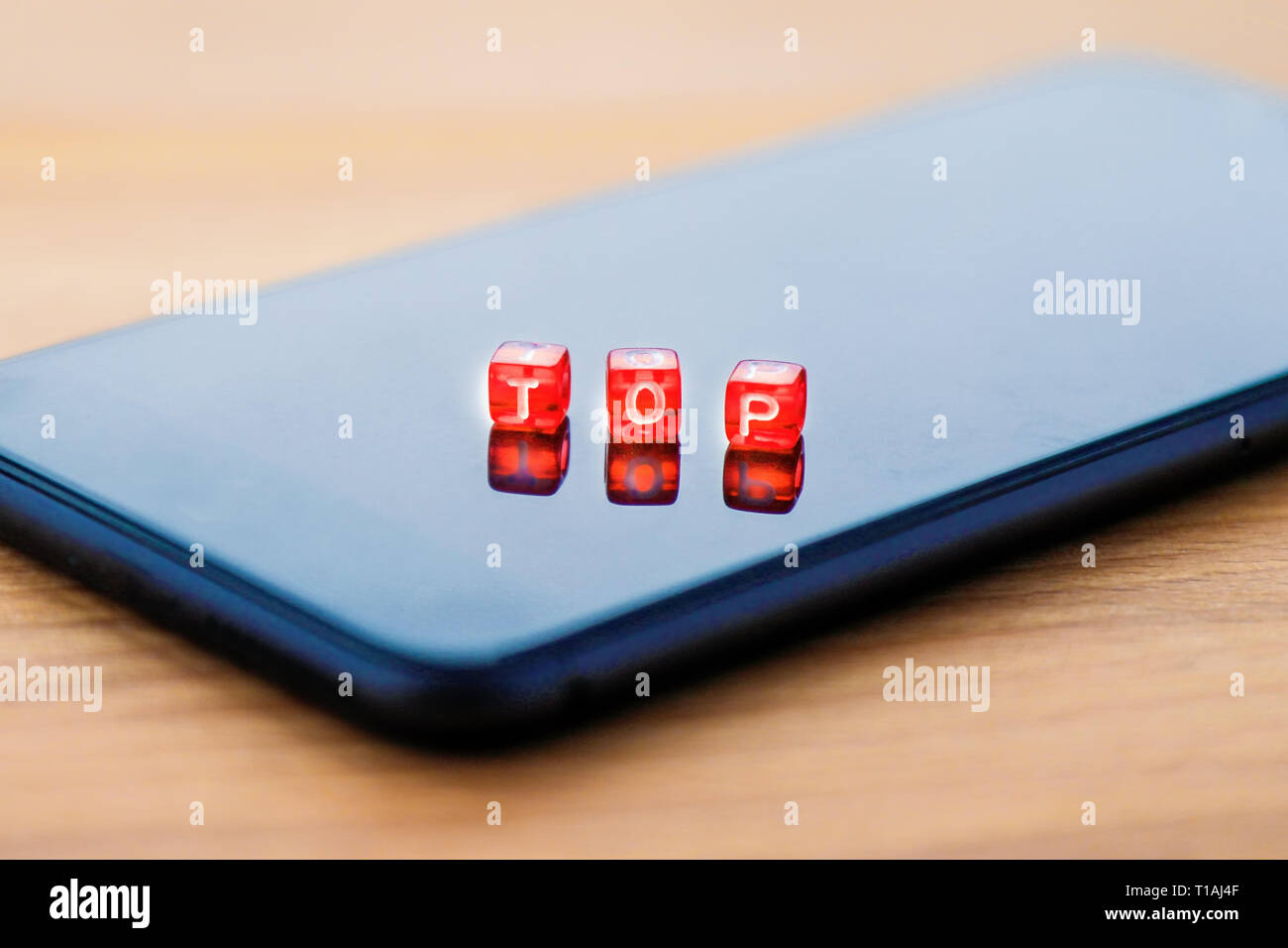 Red cubes with the word TOP on the smartphone. Rating smartphones and ...