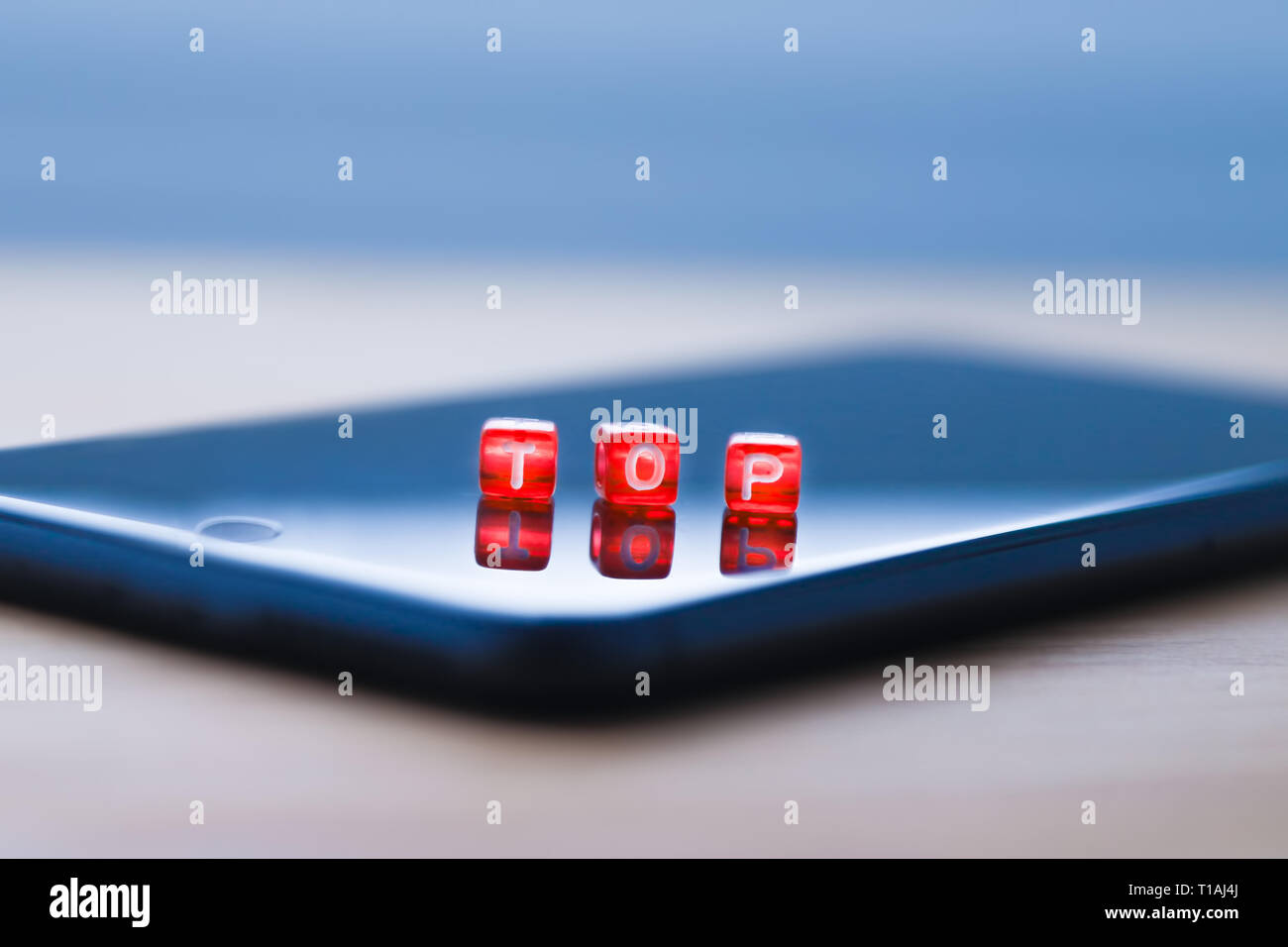 Red cubes with the word TOP on the smartphone. Rating smartphones and ...