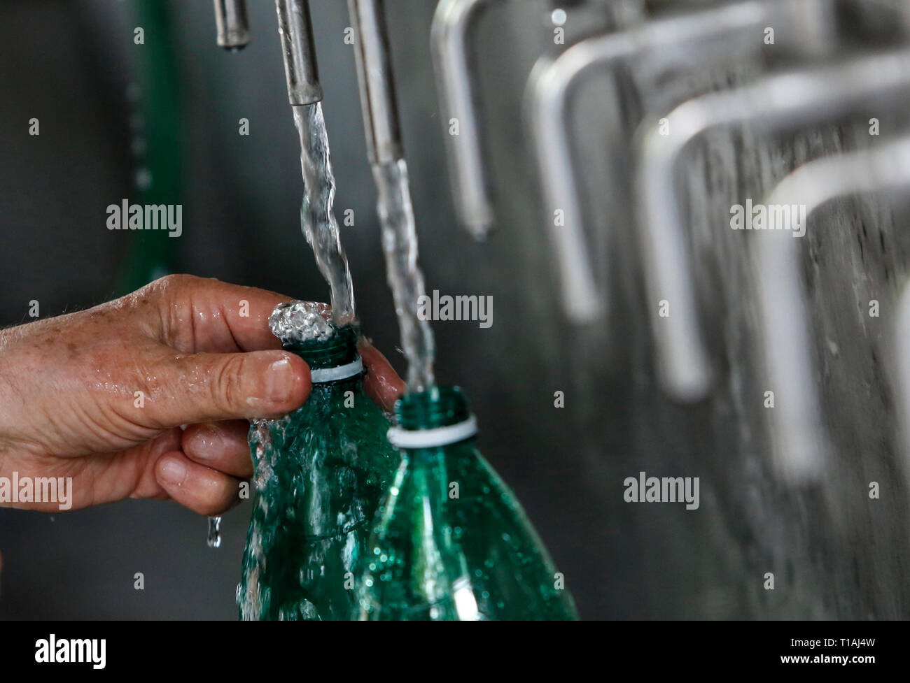 Customers get water at a source in Rome, Italy Stock Photo - Alamy
