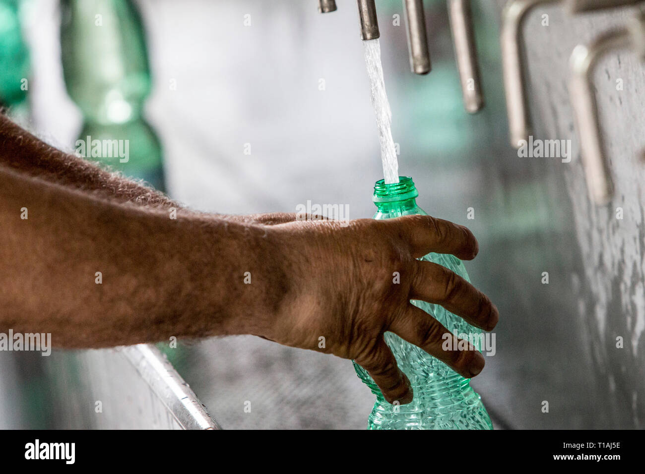 Customers get water at a source in Rome, Italy Stock Photo - Alamy