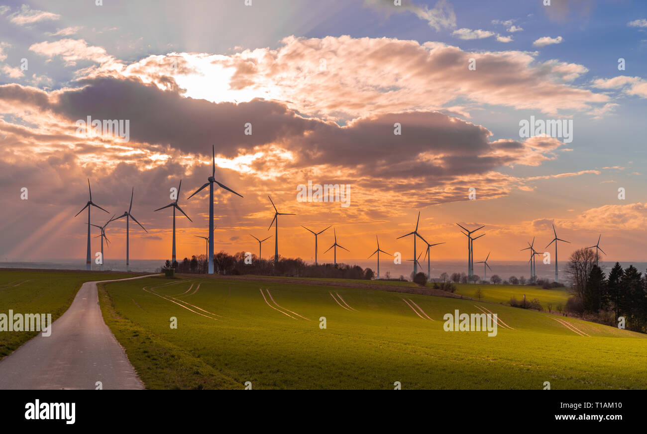 Sunset over wind turbines Stock Photo - Alamy