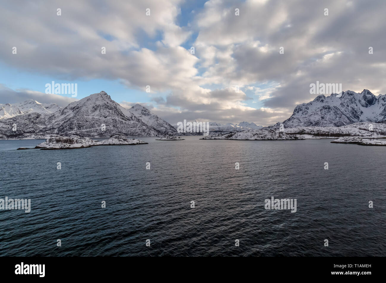 A view looking up the Norwegian Fjords during winter, showing snow ...