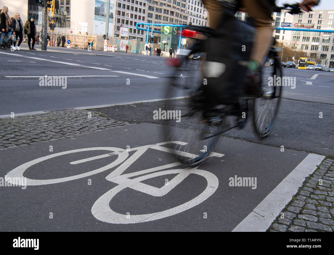 Berlin, Germany. 22nd Mar, 2019. A cyclist rides along the cycle path ...