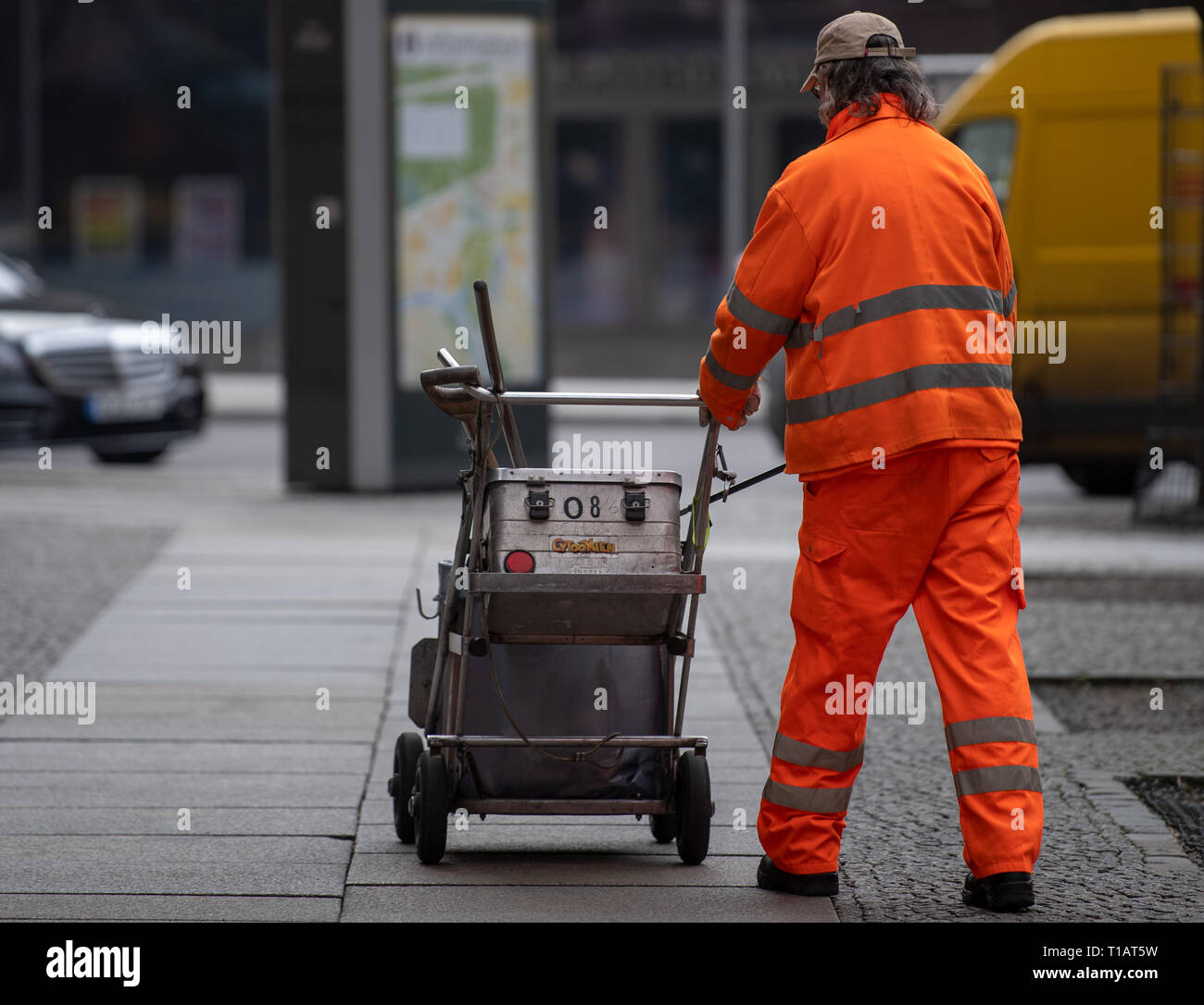 Berlin, Germany. 22nd Mar, 2019. An employee of the city cleaning goes ...