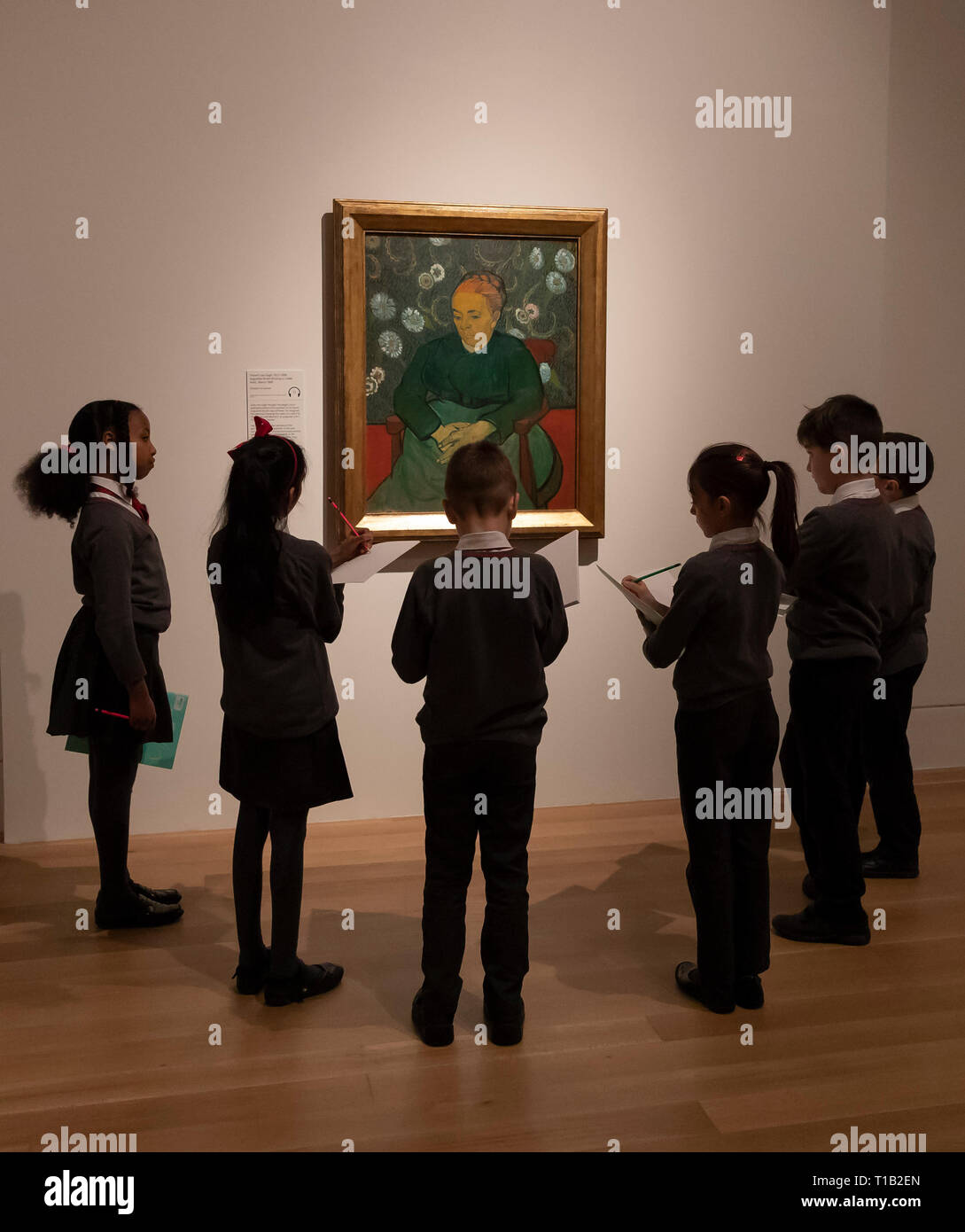 London, UK. 25th Mar, 2019. School children study the painting by ...
