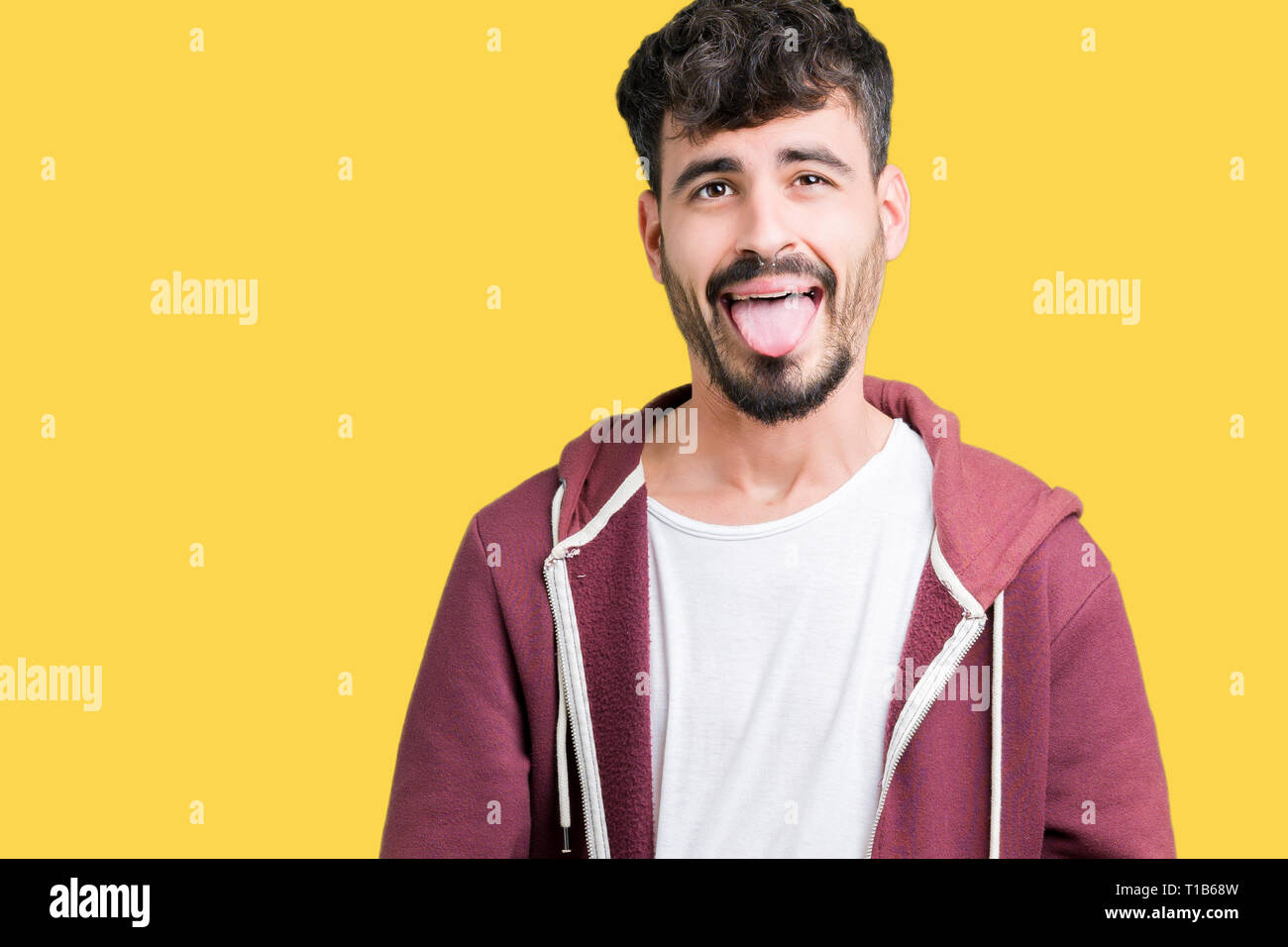 Young Handsome Man Over Isolated Background Sticking Tongue Out Happy