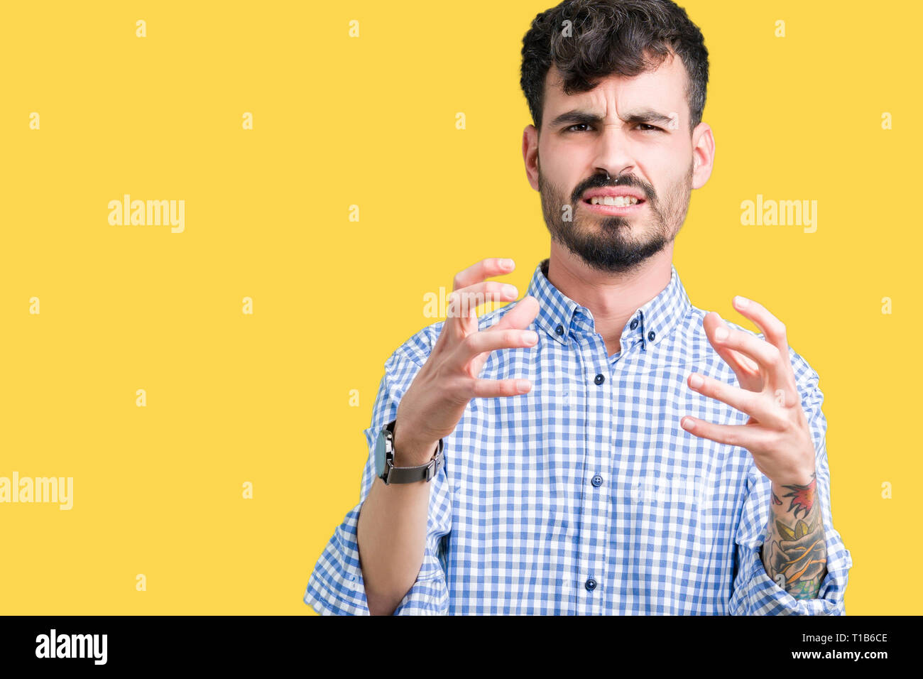 Young handsome business man over isolated background Shouting ...