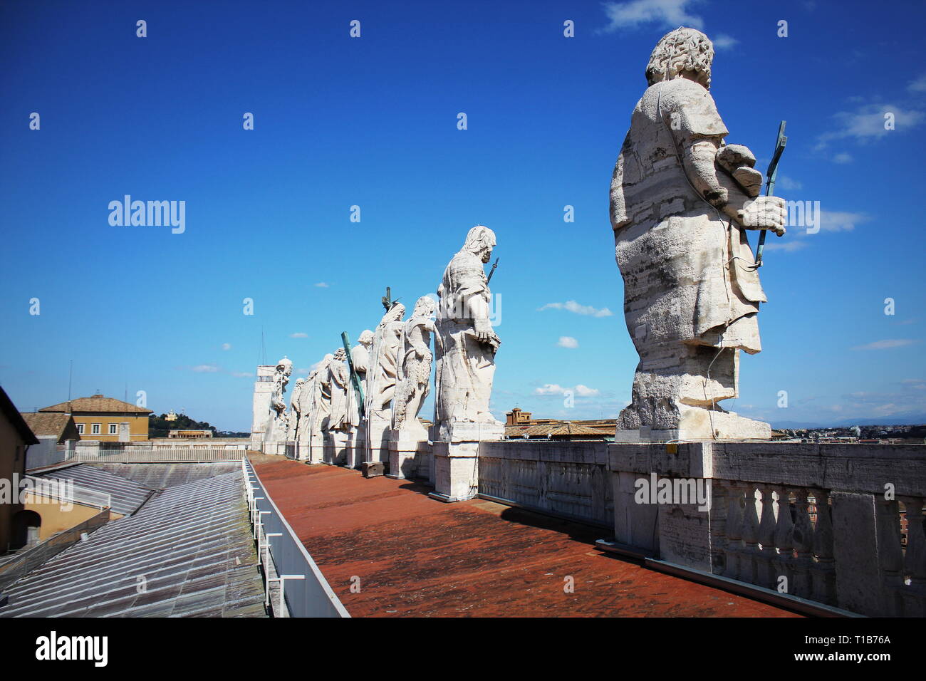 Statues on the top of st peters basilica hi-res stock photography and ...