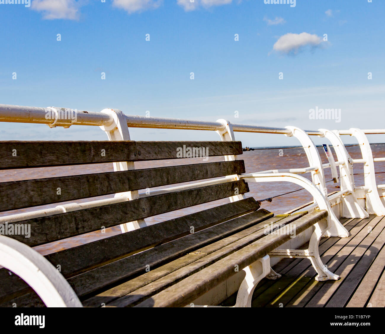 Wooden bench seating on Cromer pier Stock Photo - Alamy