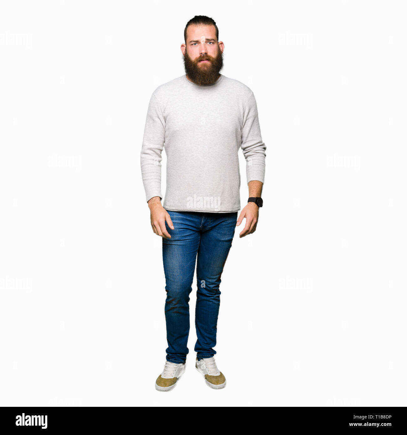 Young blond man wearing casual sweater depressed and worry for distress ...