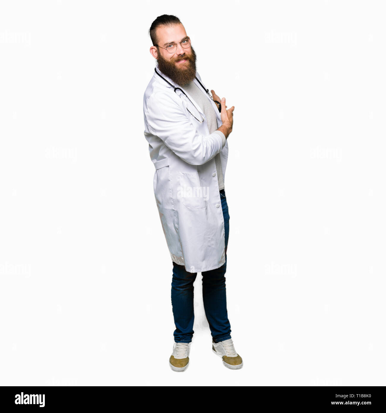 Young blond doctor man with beard wearing medical coat Inviting to ...