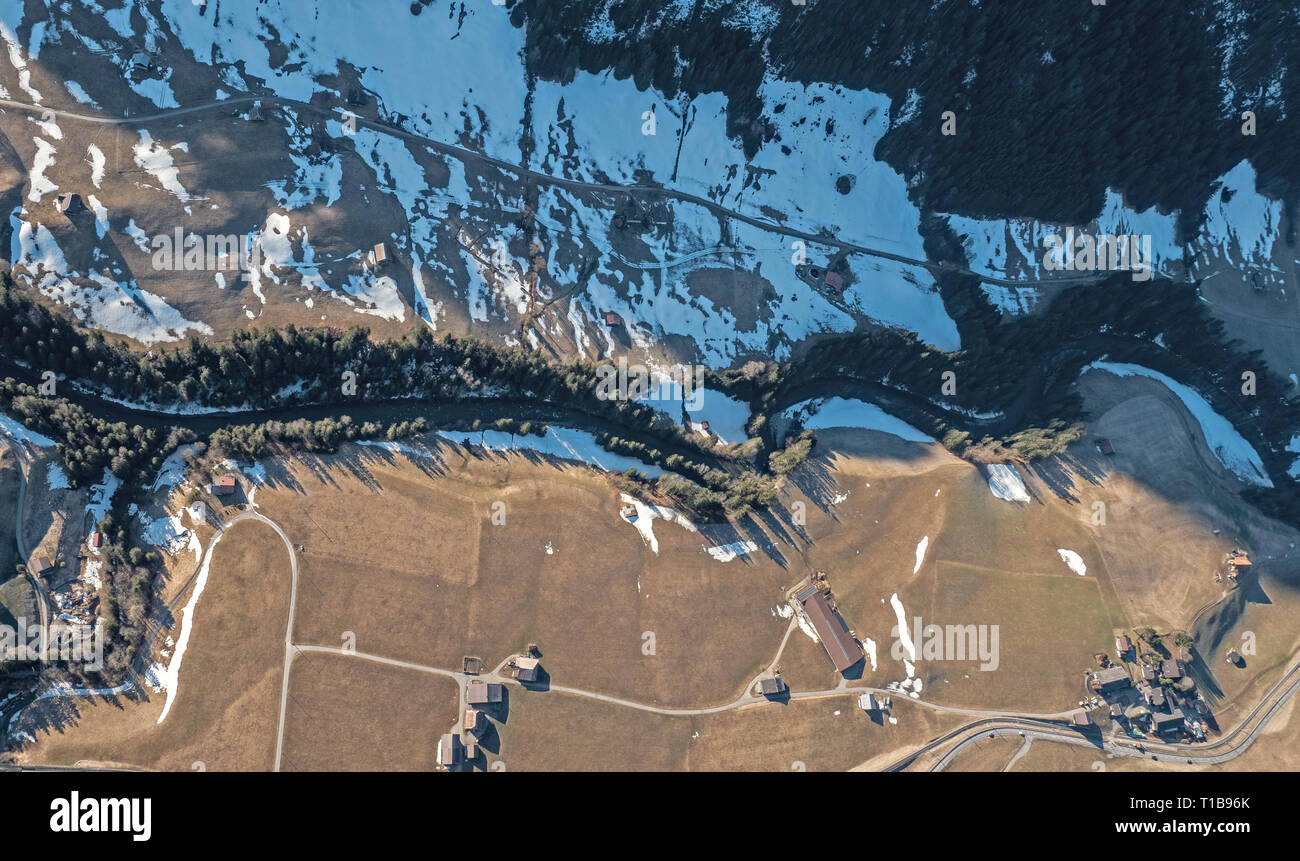 stunning Aerial top down views of a alpine river valley winding though ...