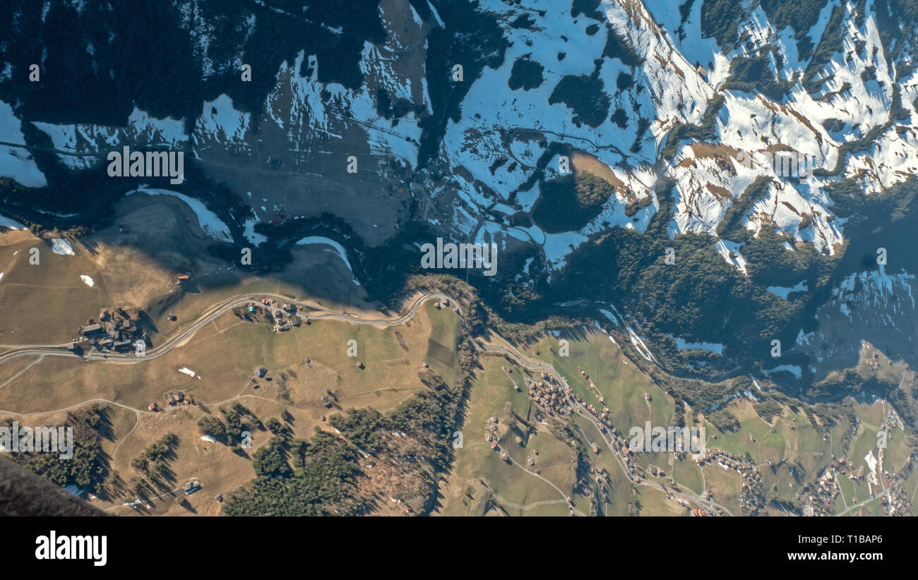 stunning Aerial top down views of a alpine river valley winding though ...