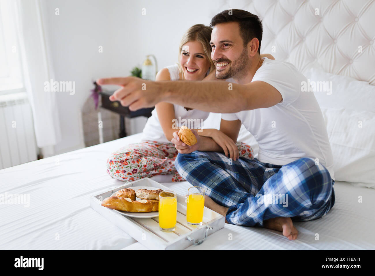 Young couple having having romantic times in bedroom Stock Photo - Alamy