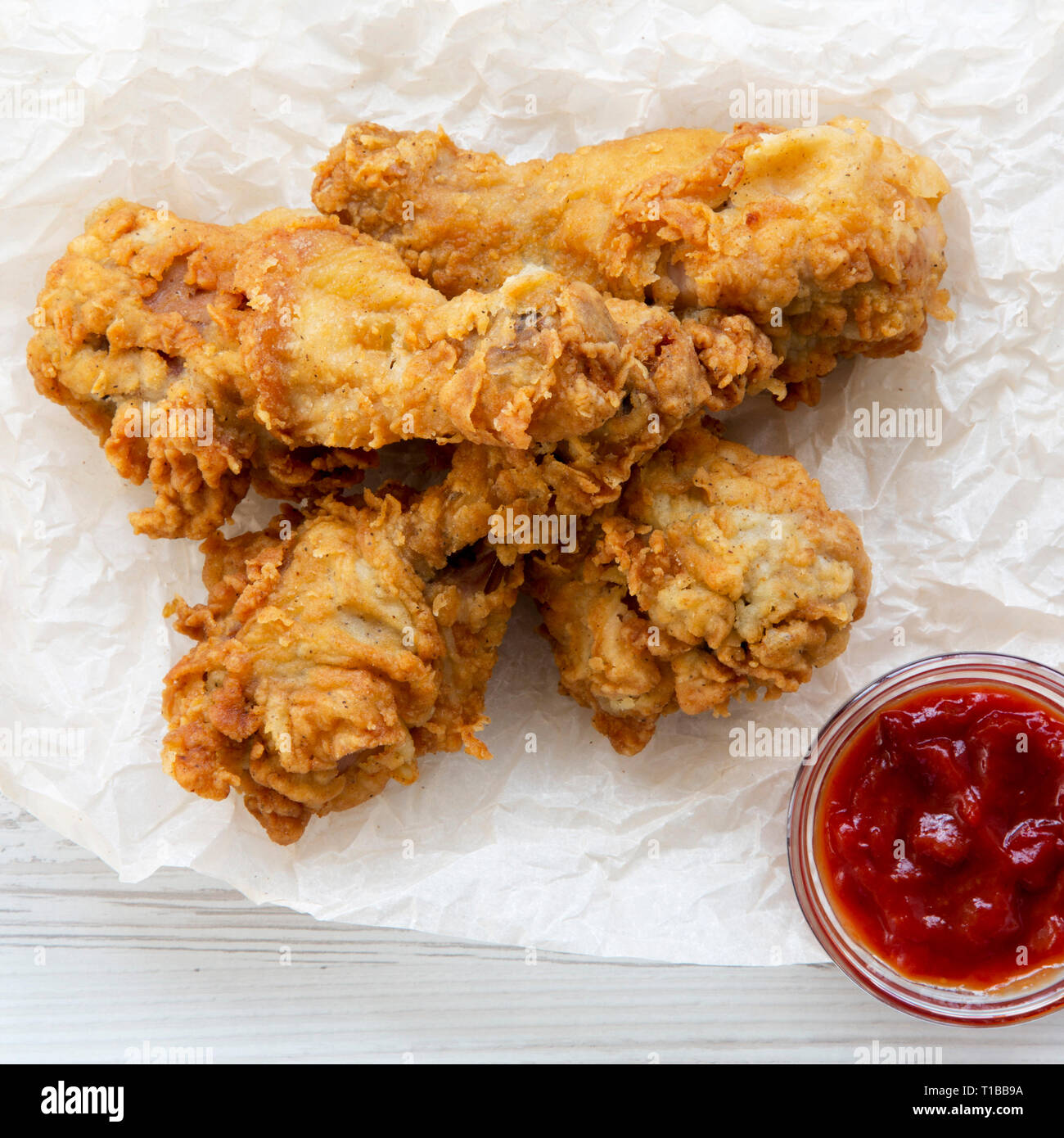 Fried chicken legs with ketchup, top view. From above, overhead Stock ...