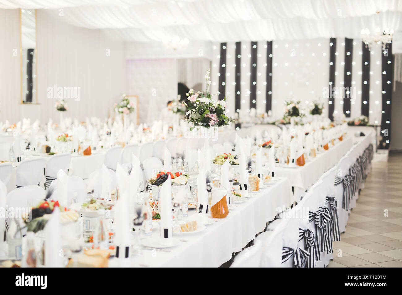 Interior of a restaurant prepared for wedding ceremony Stock Photo - Alamy