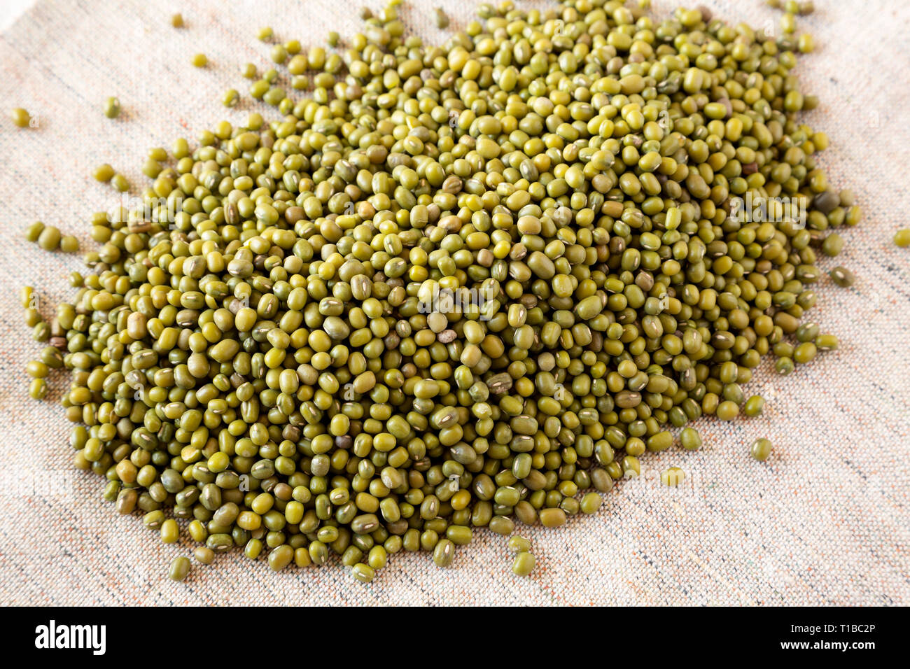 Raw green mung beans on cloth, close-up Stock Photo - Alamy