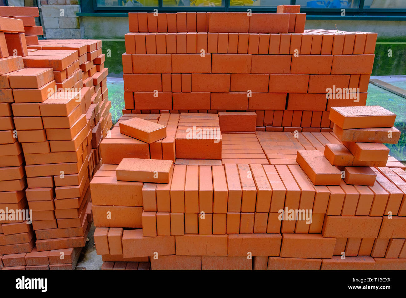 Stack of red bricks for build construction Stock Photo - Alamy