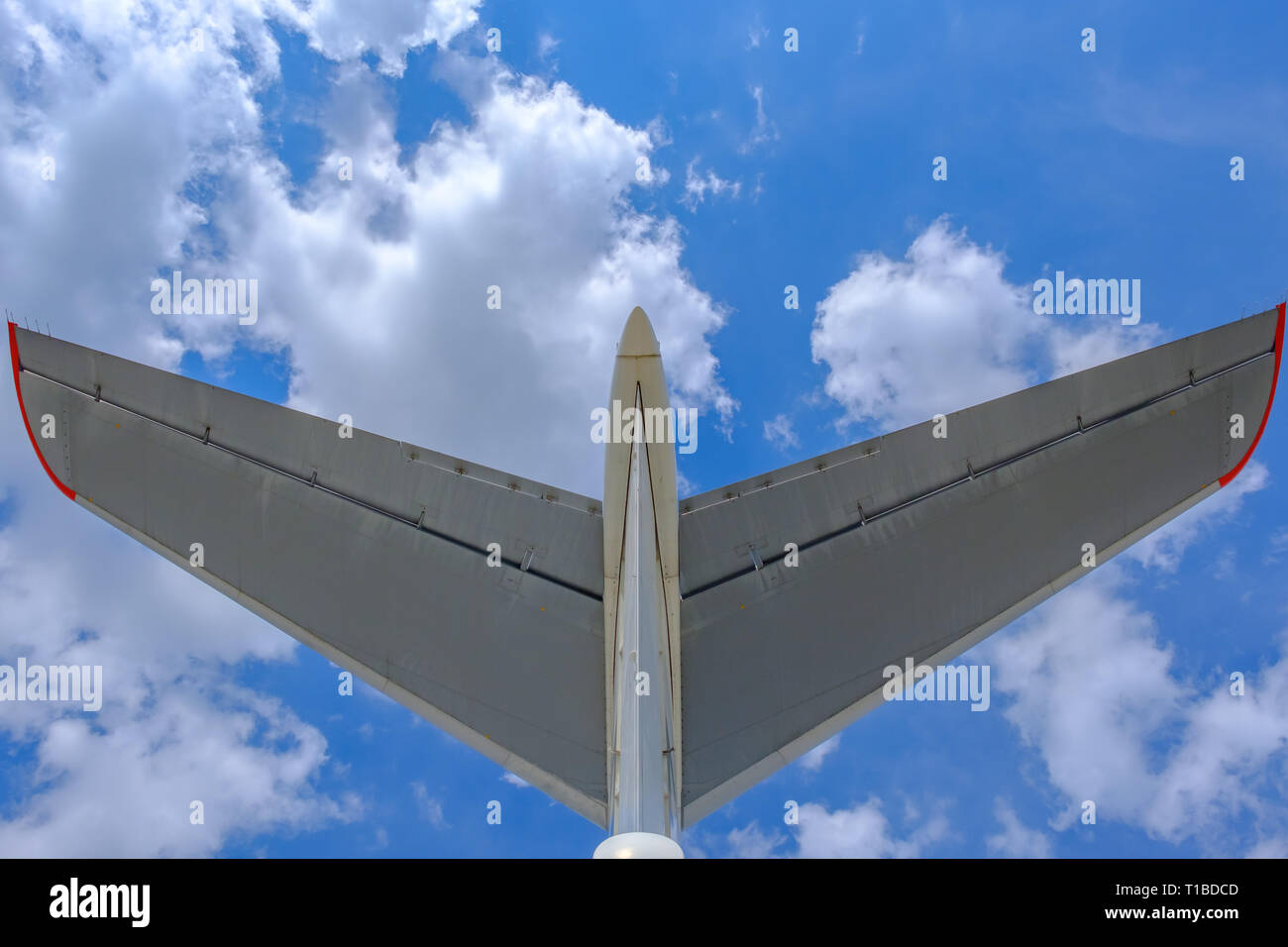 Tail of a passenger airplane on blue sky background with clouds Stock ...