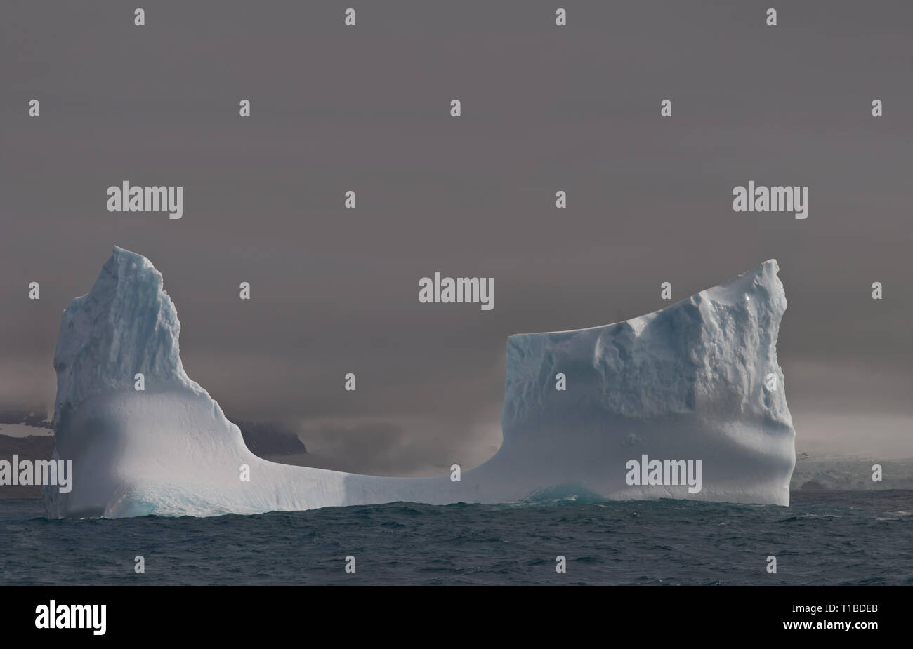 iceberg with dramatic lighting Stock Photo - Alamy