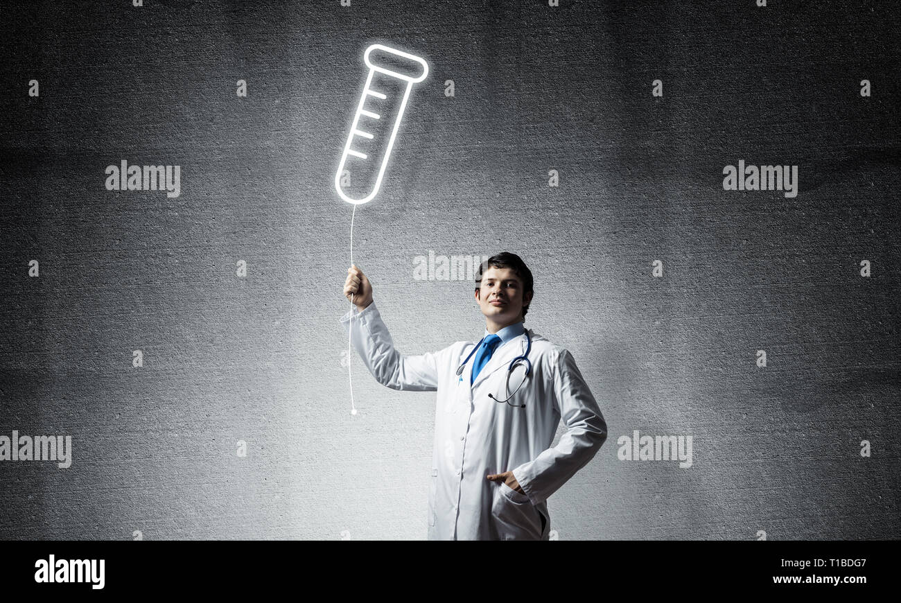 Doctor and vial symbol Stock Photo - Alamy