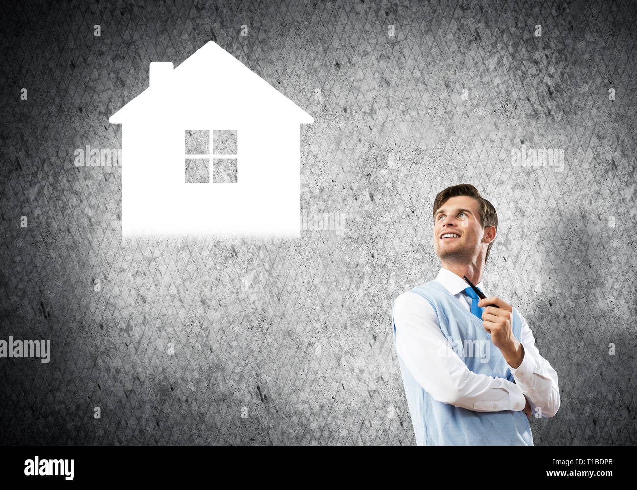 Elegant banker wearing red tie and house sign as banking concept Stock ...