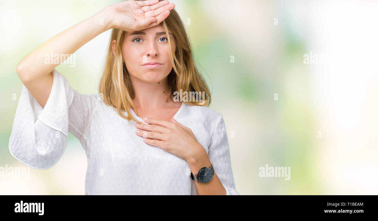 Beautiful young elegant woman over isolated background Touching ...