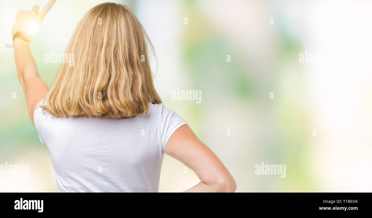 Beautiful young woman wearing casual white t-shirt over isolated ...