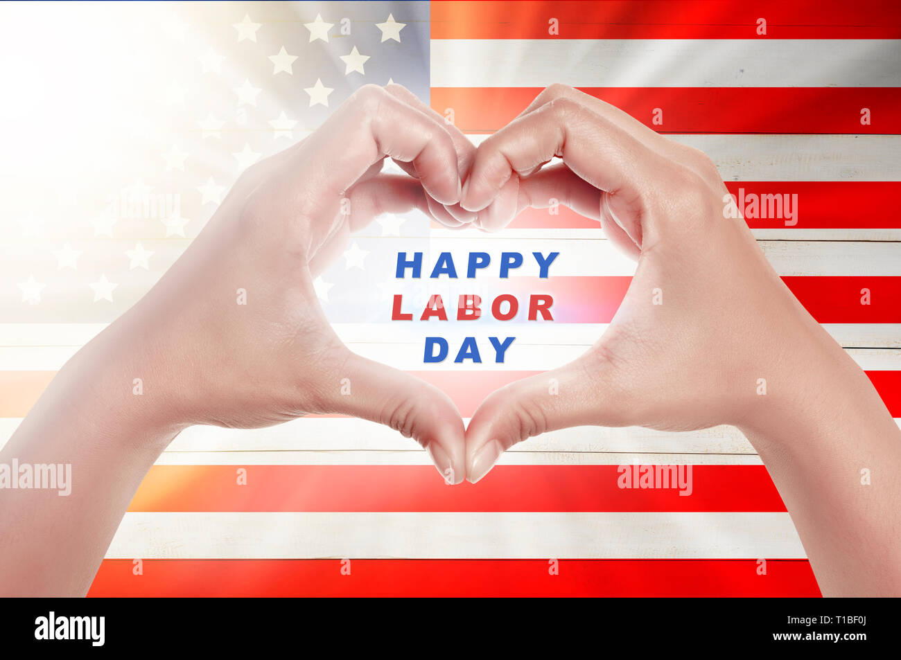 Human hands in heart shape with Happy labor day text over american flag ...