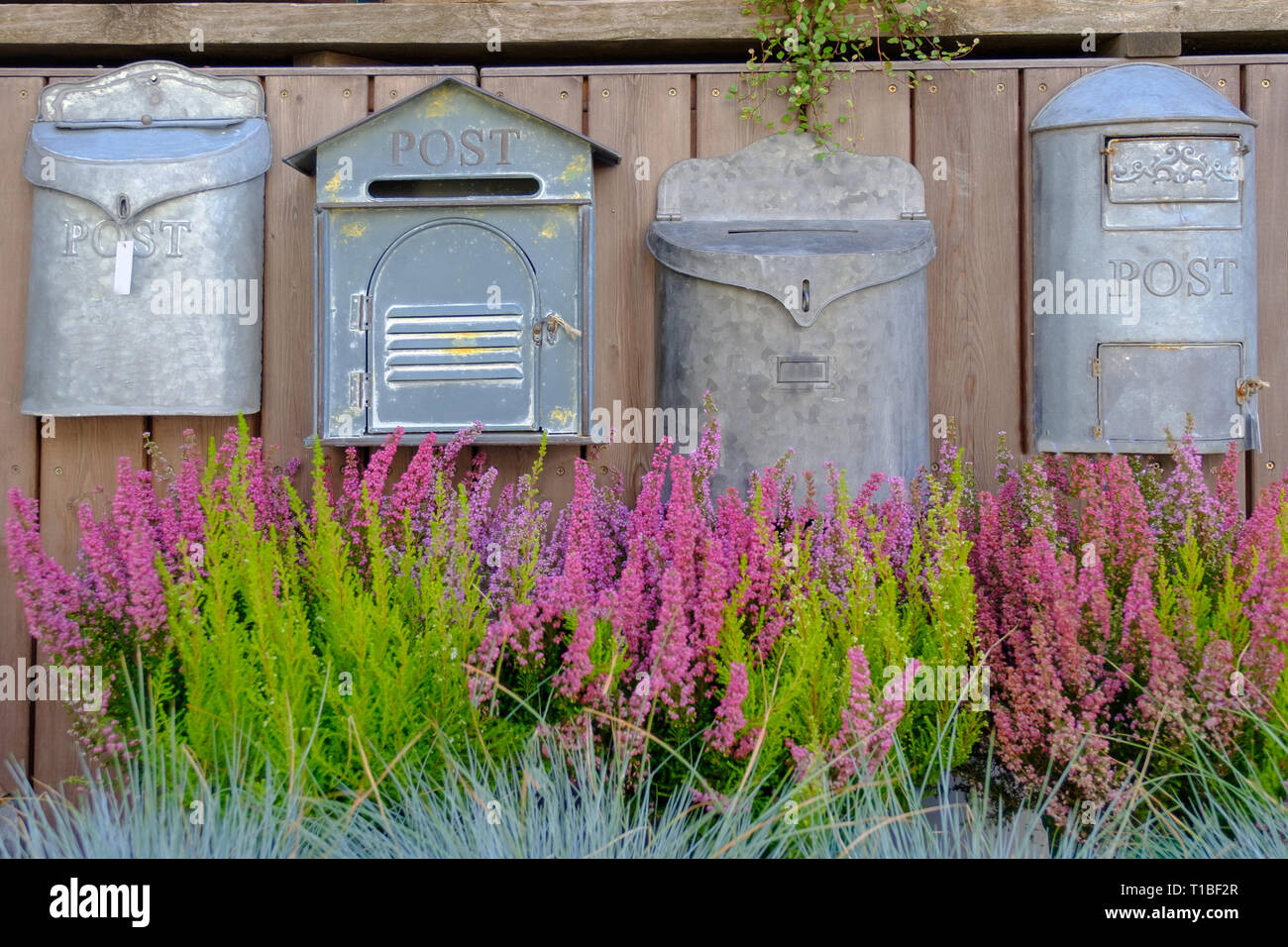 Various old post boxes on the wall Stock Photo - Alamy