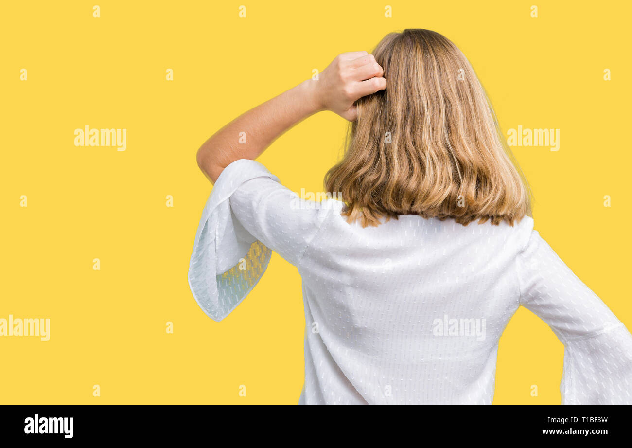 Beautiful young elegant woman over isolated background Backwards ...