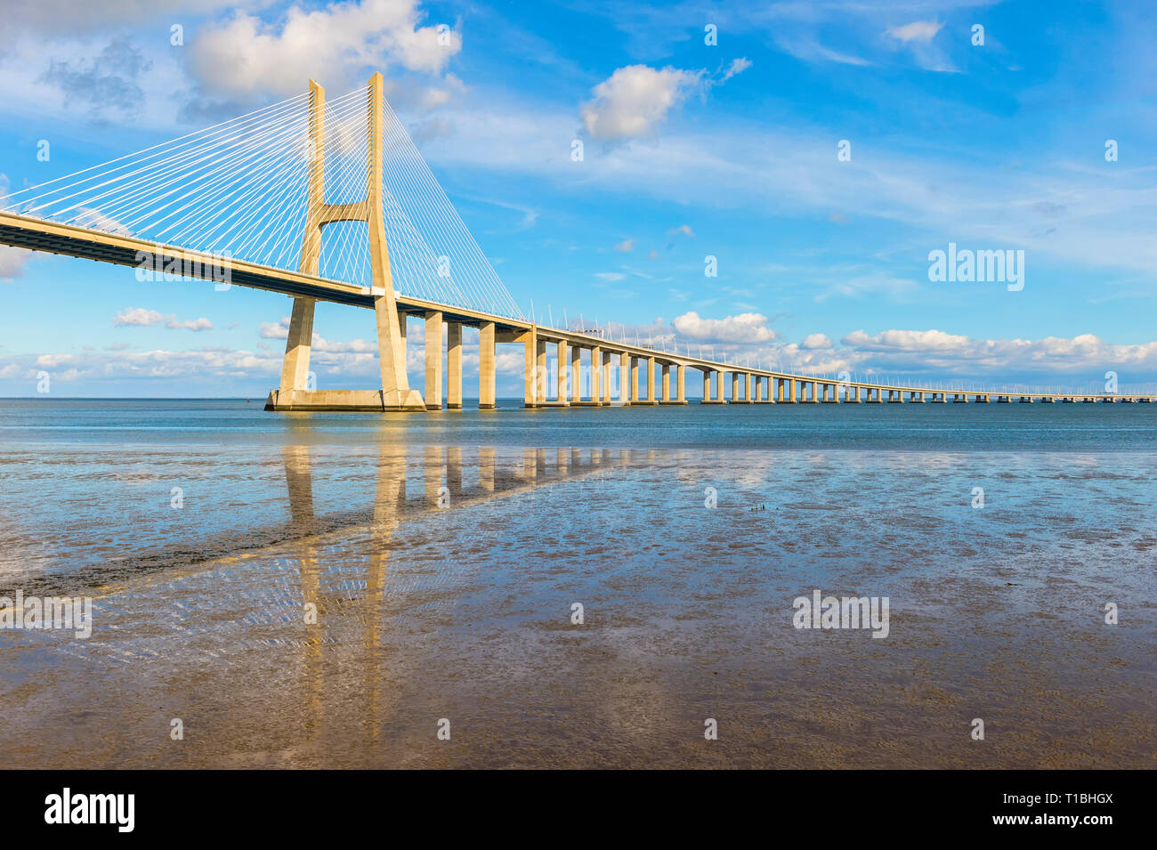 Vasco de Gama Bridge reflecting in the Tagus river, Lisbon, Portugal ...