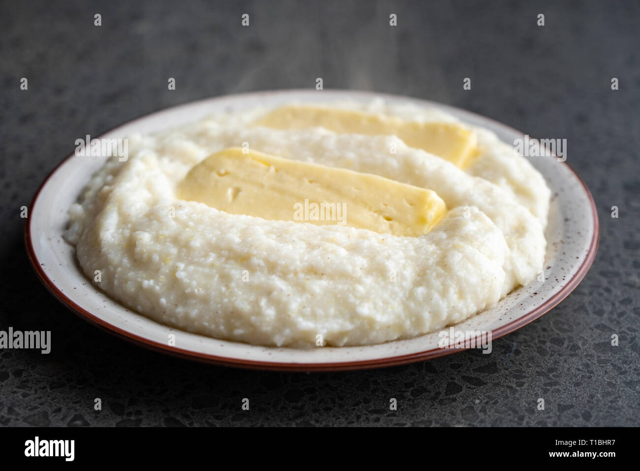Mengrelian corn mamalica (ghomi) with cheese. Georgian traditional food ...