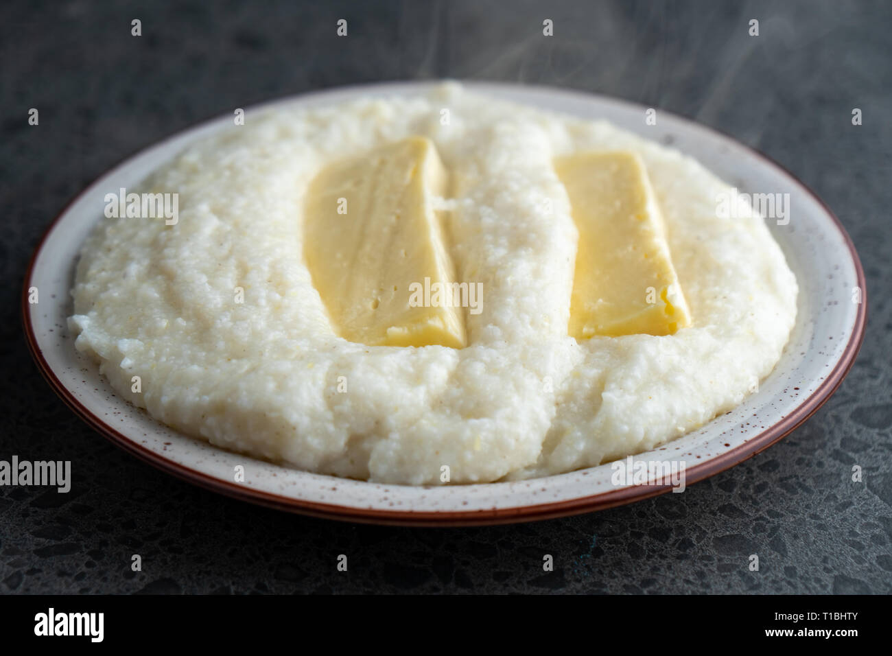 Mengrelian corn mamalica (ghomi) with cheese. Georgian traditional food ...
