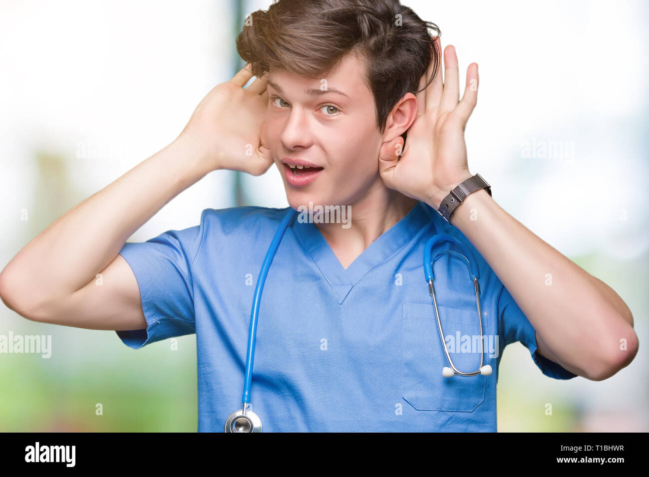Young doctor wearing medical uniform over isolated background Trying to ...