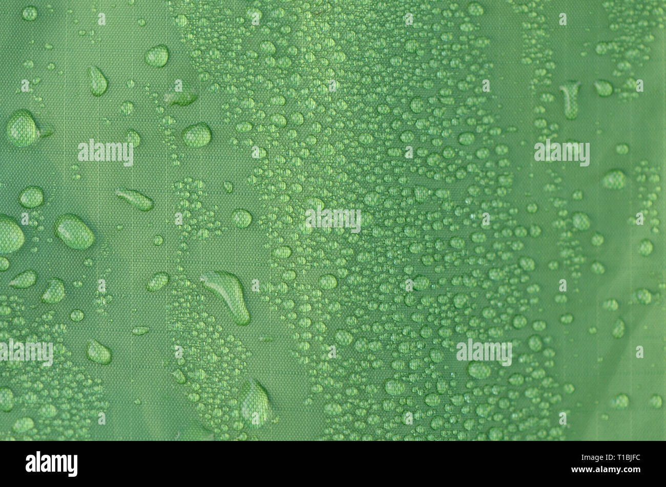 Raindrops on tourist tent. Green fabric texture with drops Stock Photo ...