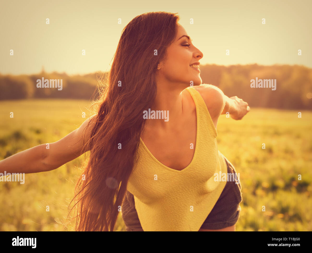 Beautiful toothy natural smiling relaxing woman wanting to fly and ...