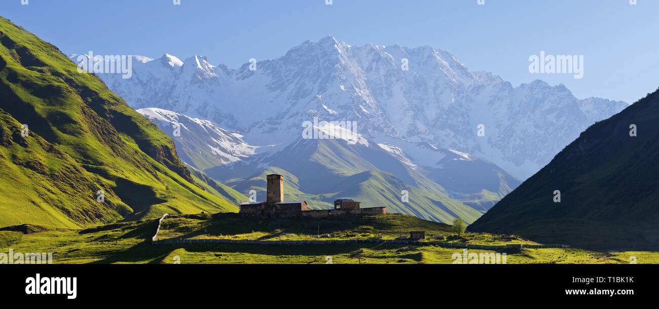 Panorama Caucasus Mountains. Stone medieval church in a mountain valley ...