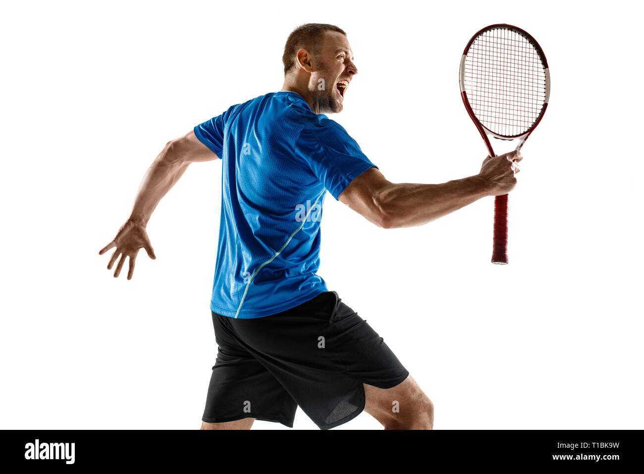 Portrait of a handsome male tennis player celebrating his success ...