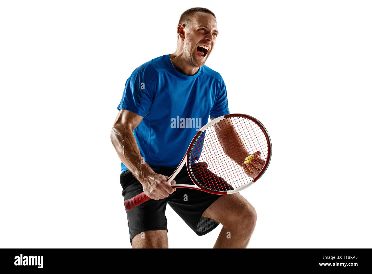 Portrait of a handsome male tennis player celebrating his success ...