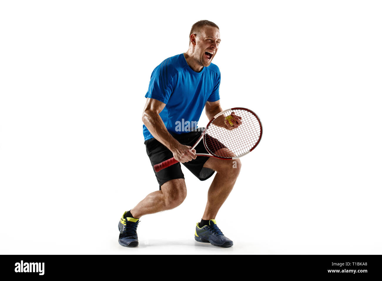 Portrait of a handsome male tennis player celebrating his success ...