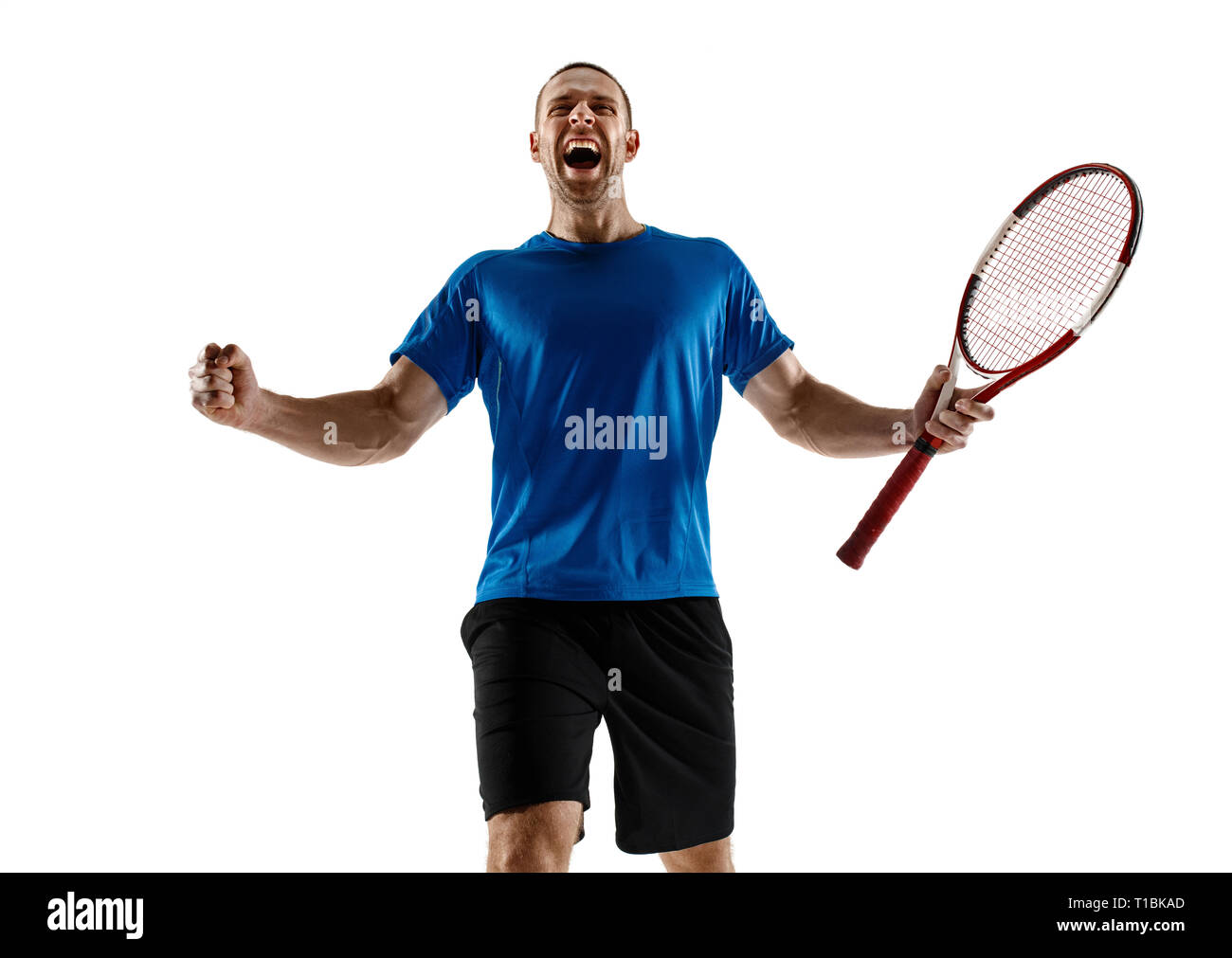 Portrait of a handsome male tennis player celebrating his success ...
